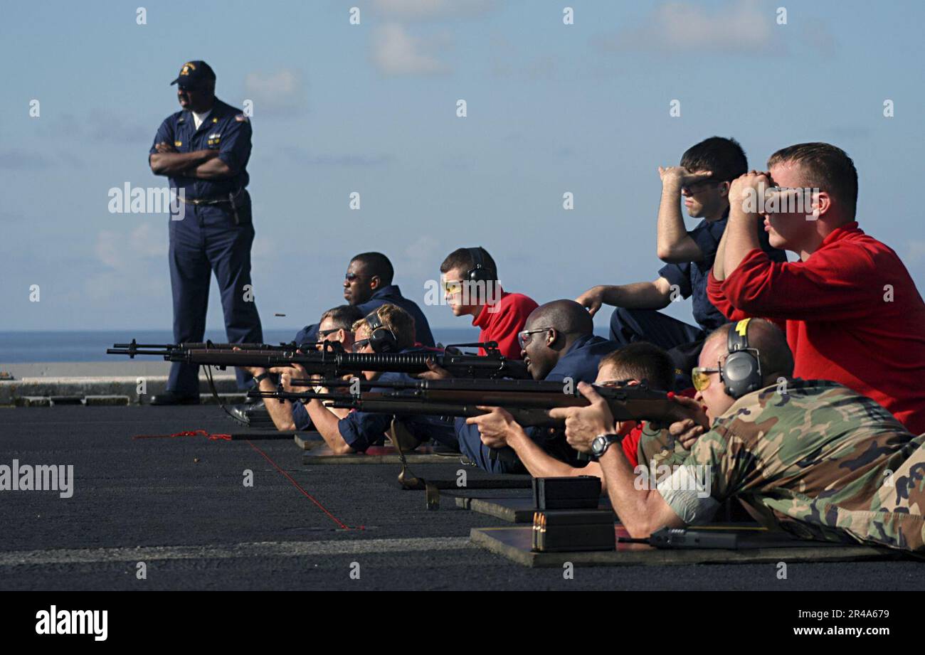 US Navy Master-at-Arms 1st Class and members of Weapons department, G-2 ...