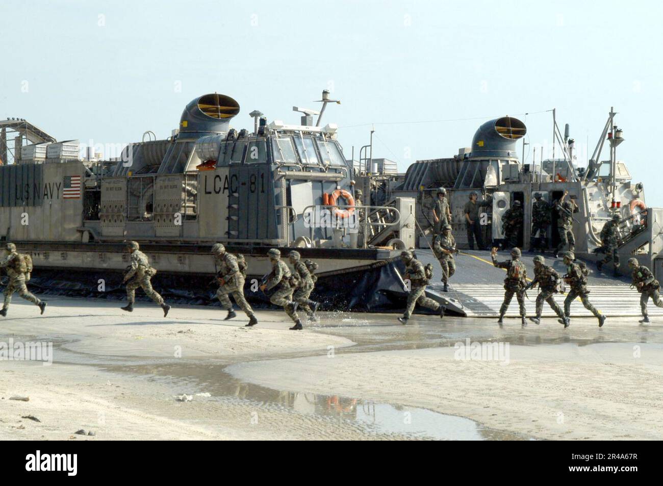 US Navy Landing force members of the Royal Malay Regiment (RMR) hit the ...