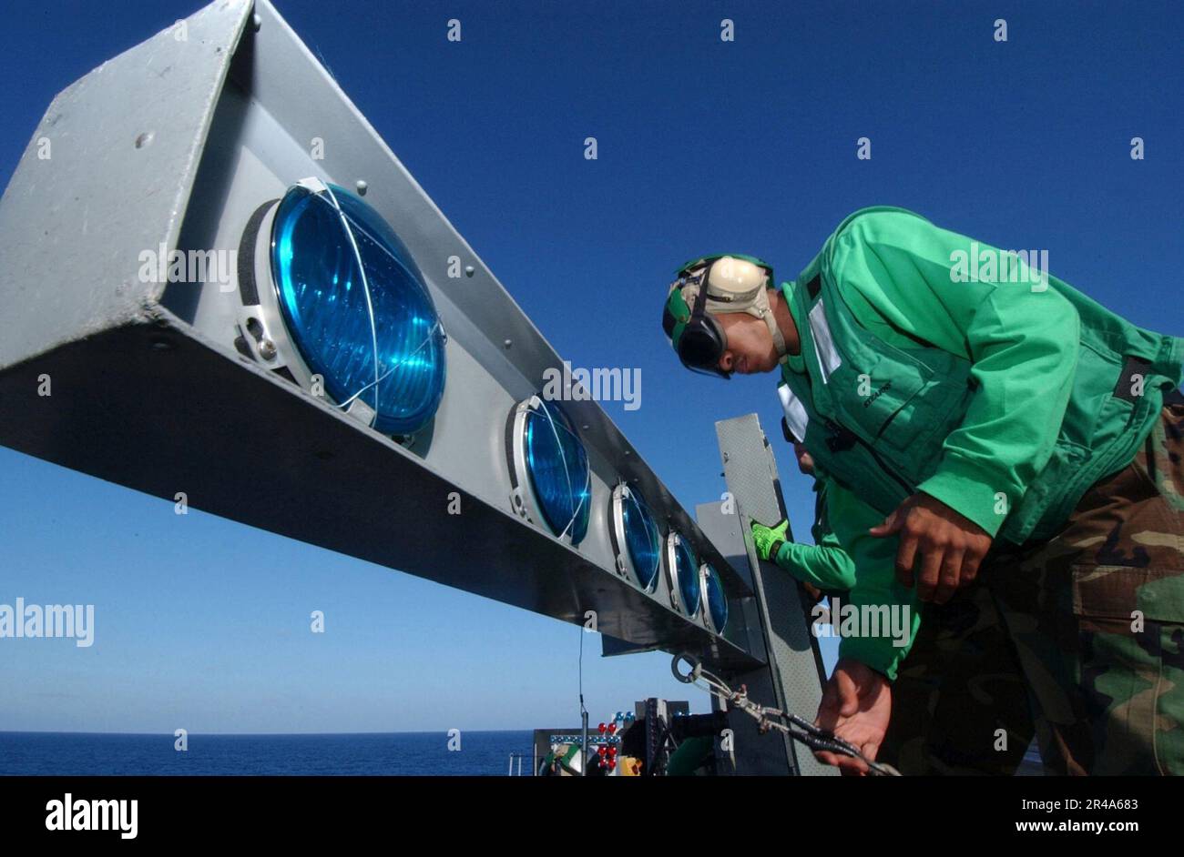 US Navy Sailors assemble the Mobile Visual Landing Aid (MOVLAS) during ...