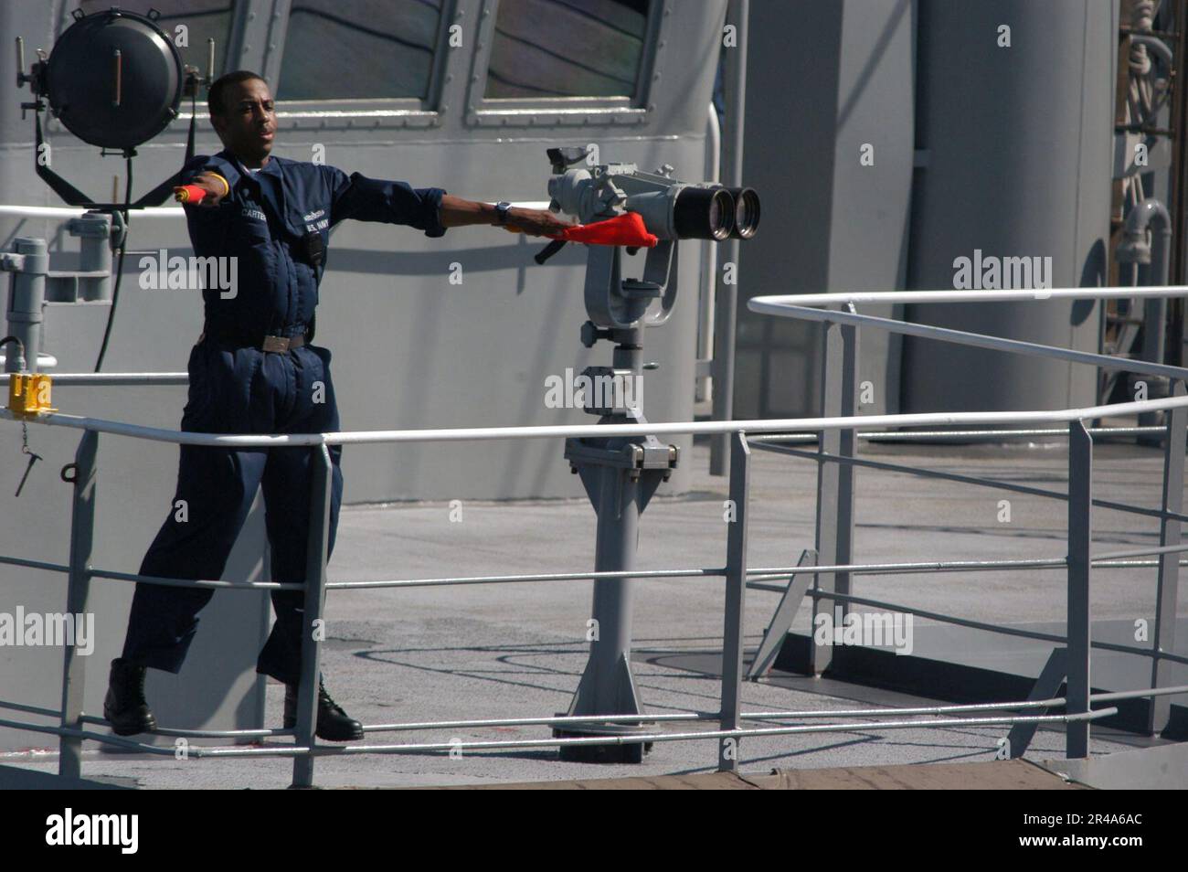 US Navy A signalman assigned to the Military Sealift Command ammunition ...