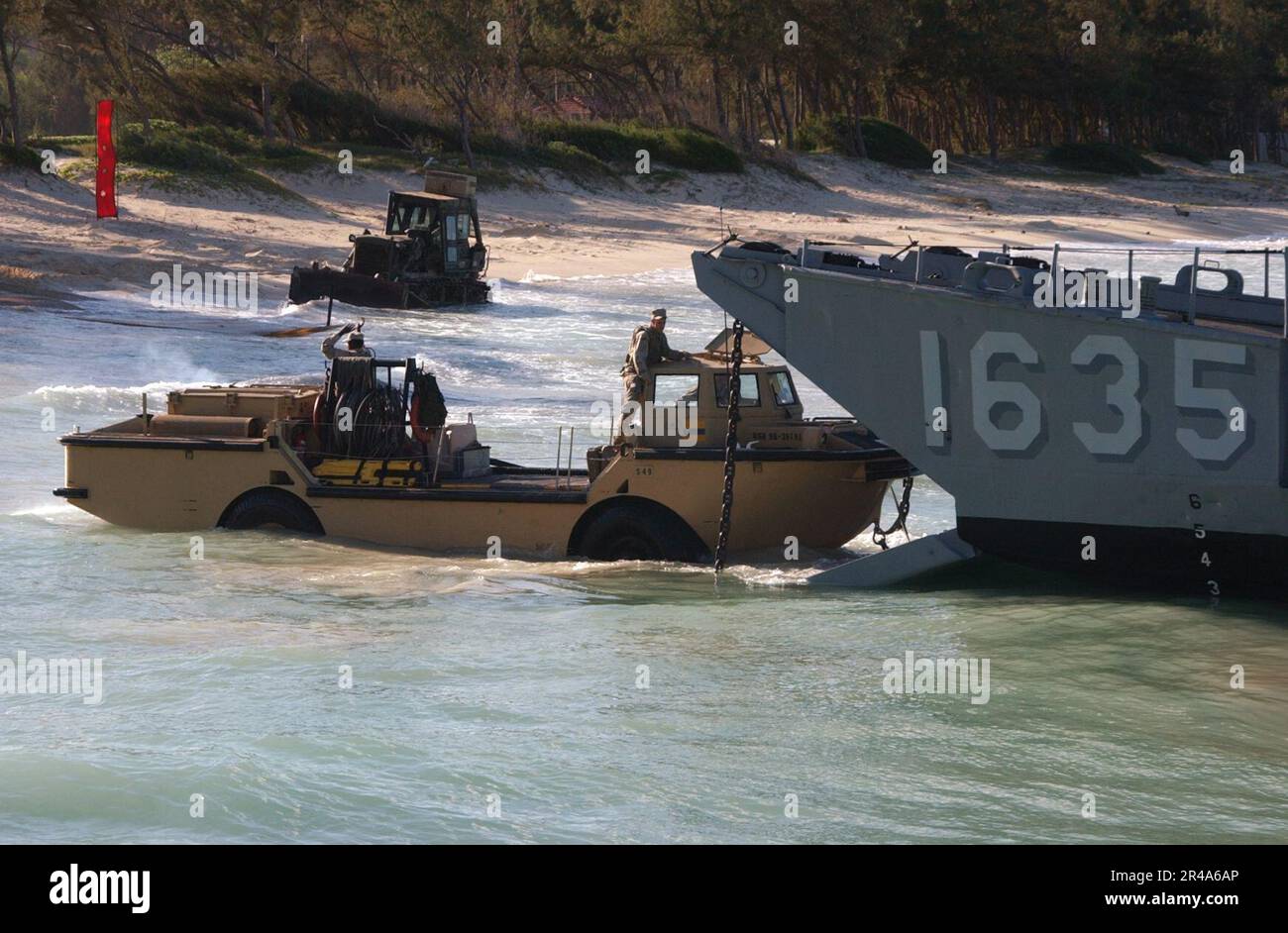 US Navy A Lighter Amphibious Resupply Cargo Vessel (LARC) checks the ...