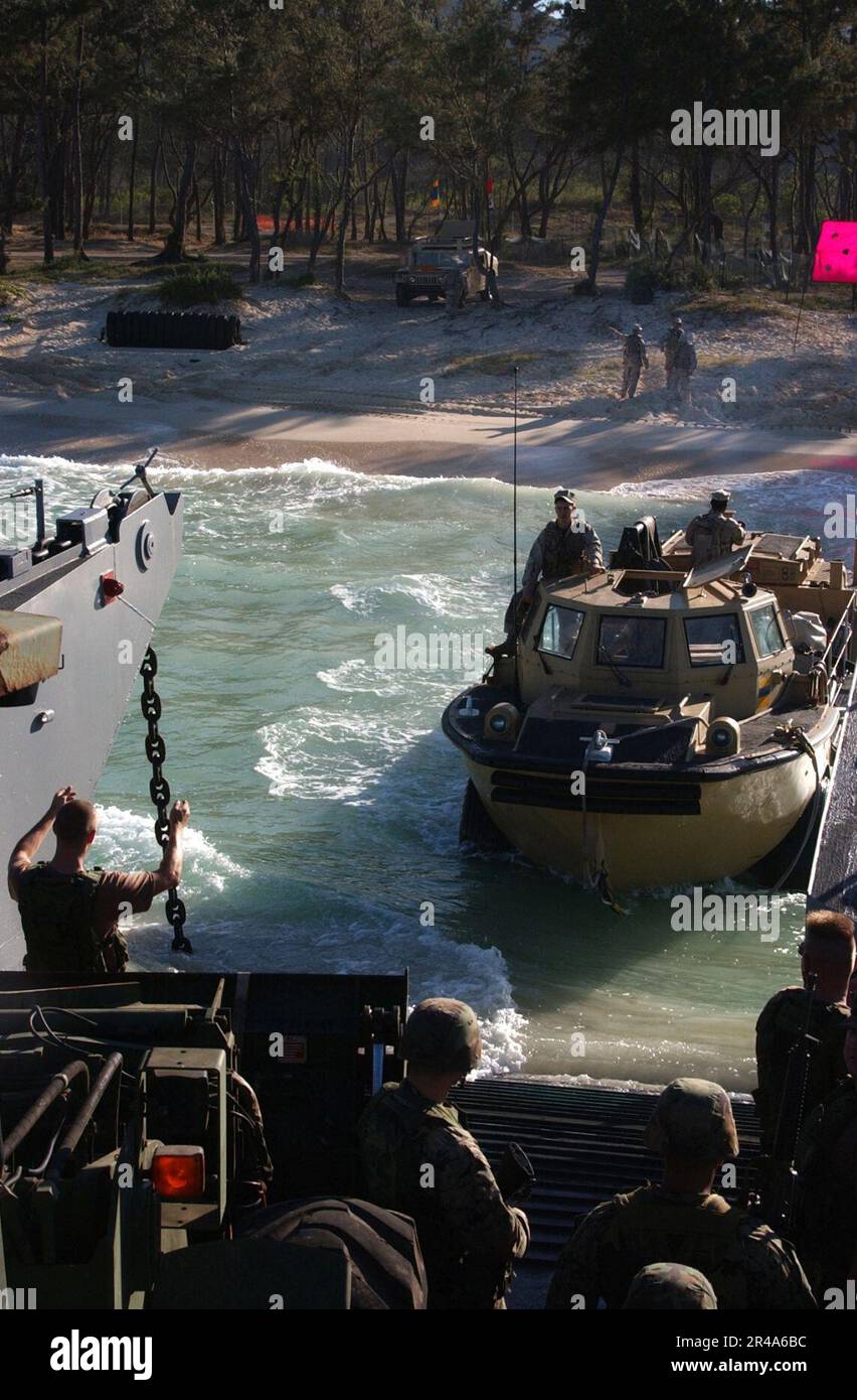 US Navy A Lighter Amphibious Resupply Cargo Vessel (LARC) checks the ...