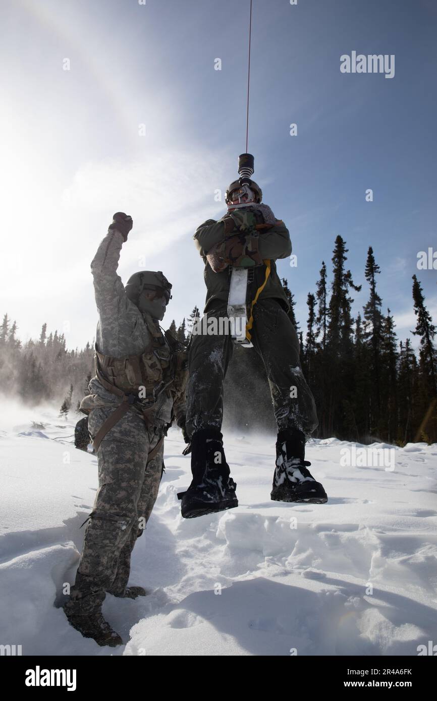 U.S. Army Sgt. Chase Tomlinson, Critical Care Fight Paramedic, signals ...