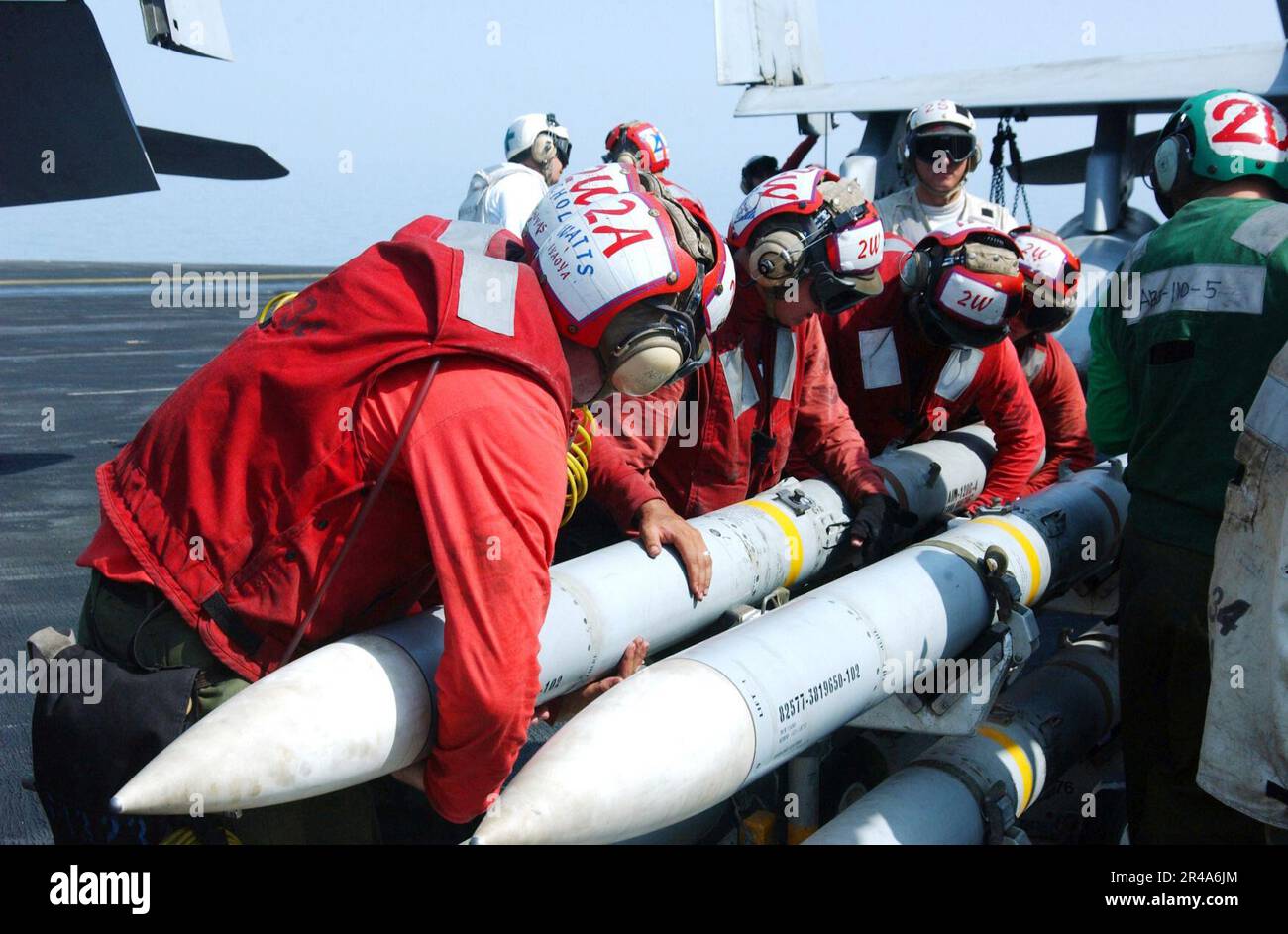 US Navy Ordnancemen assigned to the Blue Blasters of Strike Fighter ...