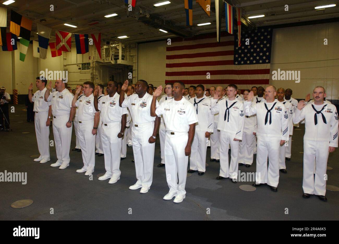 US Navy Sailors aboard USS Ronald Reagan (CVN 76) receive the oath ...