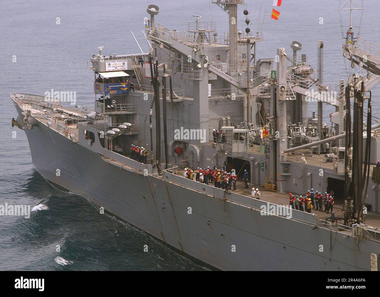 US Navy Sailors assigned to the fast combat support ship USS Seattle ...