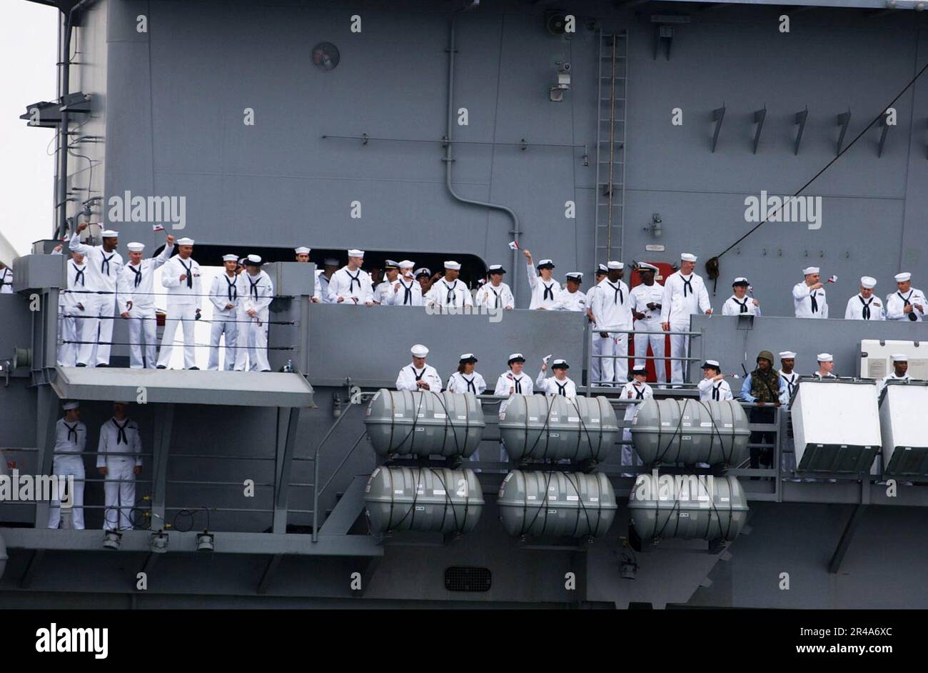 US Navy Crew members man the rails aboard USS Ronald Reagan (CVN 76 ...
