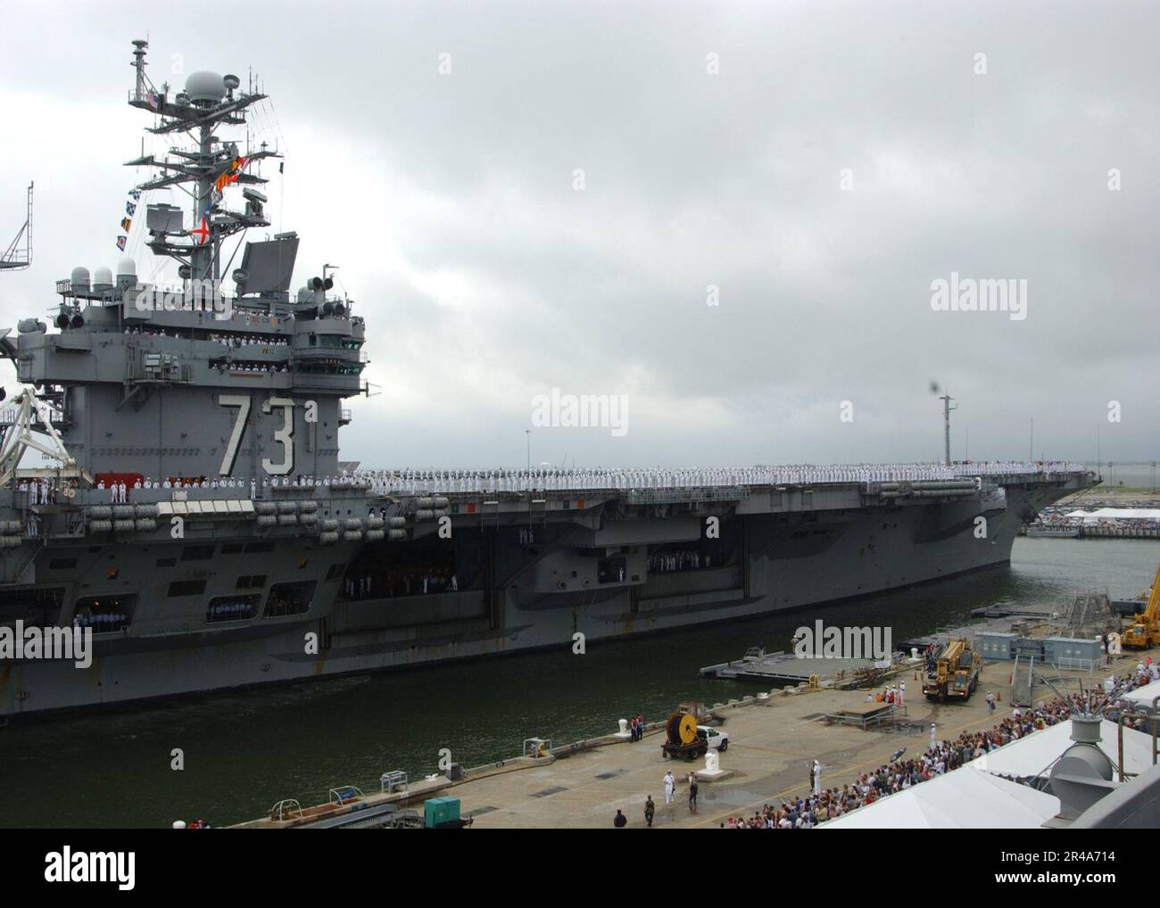 US Navy Friends and family celebrate the arrival of the nuclear powered ...