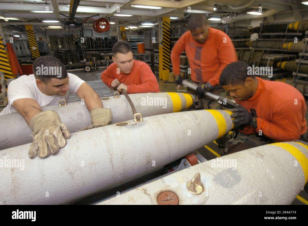 US Navy Members of G-3 bomb assembly division assemble a MK-82 500lb ...