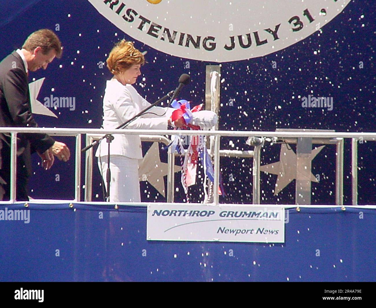 US Navy First Lady Laura Bush christens PCU Texas (SSN 775) with a ...