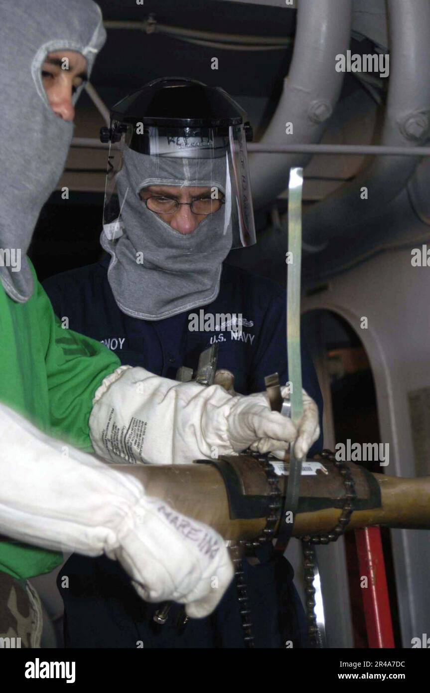 US Navy Sailors assigned to Damage Control Repair Locker One Alpha (1A ...