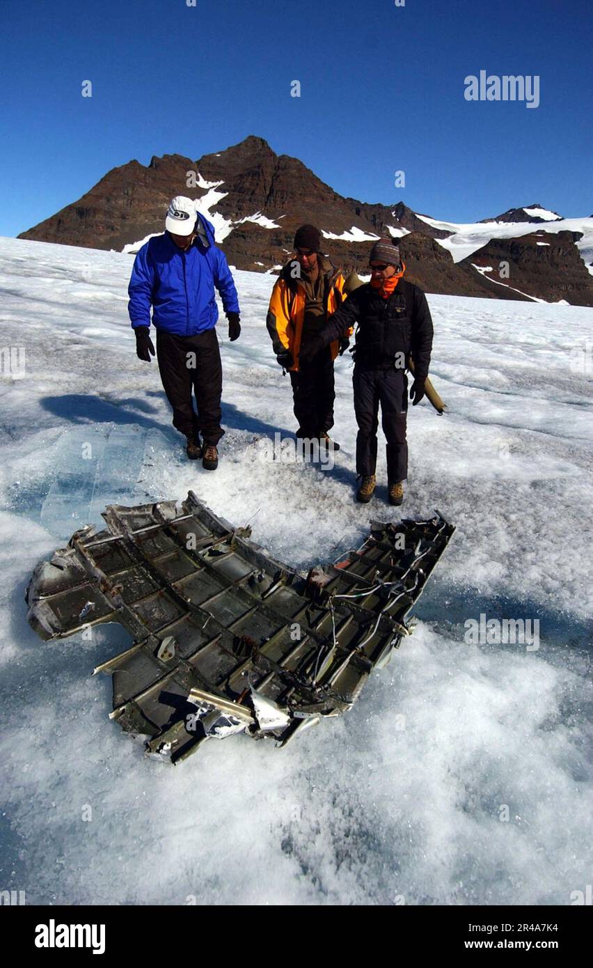 US Navy Recovery personnel examine the wreckage of a Navy P-2V Neptune ...