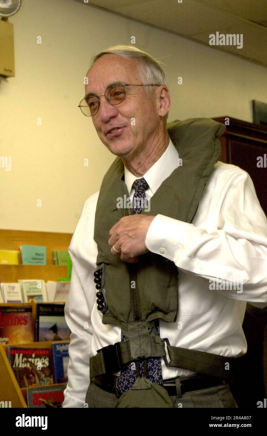 US Navy Secretary of the Navy, Gordon R. England puts on the proper ...