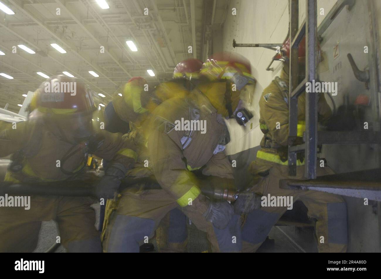 US Navy A fire team prepares to enter a refueling station after ...