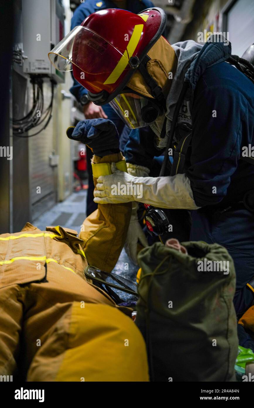 SINGAPORE (March 15, 2023) Engineman 2nd Class Adrian Belt, right, from ...