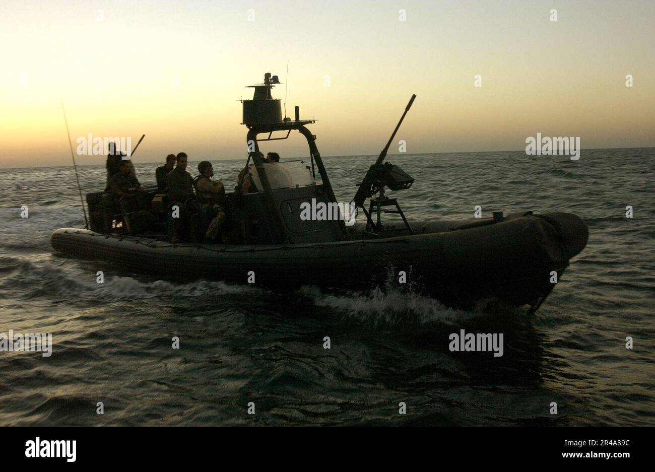 US Navy U.S. Navy special forces and Marines pull along side the dock ...