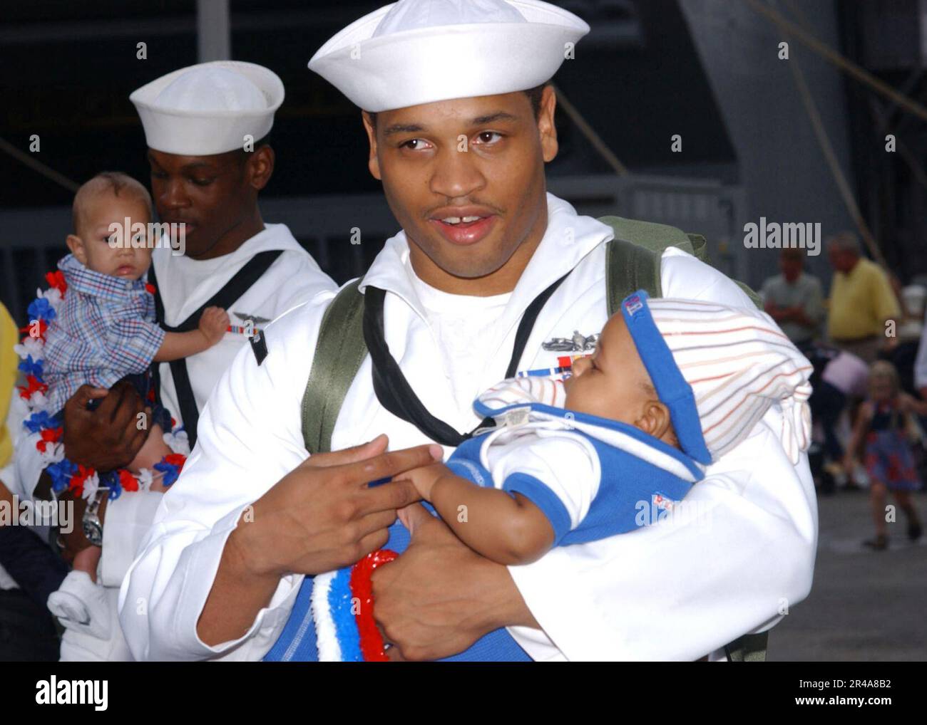 US Navy Two Sailors hold their babies for the first time after the Wasp ...