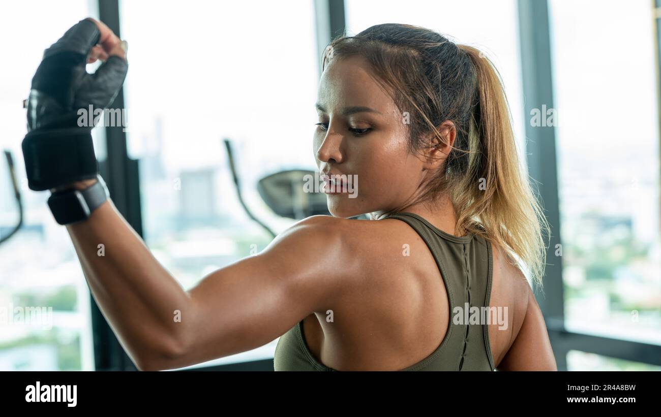 Beautiful young Girl weight training with dumbbells at Gym. Sport ...