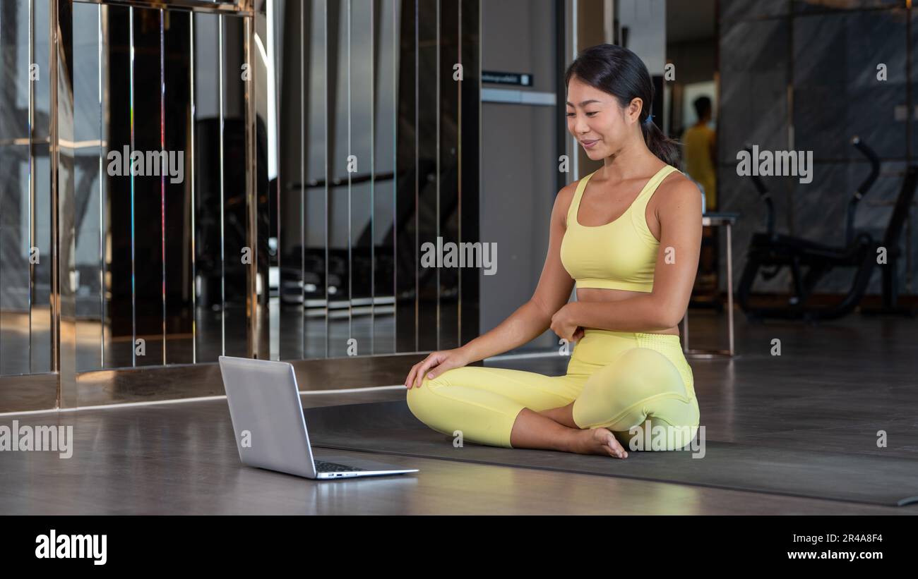 Social distance. A young woman stretching Yoga fitness instructor ...
