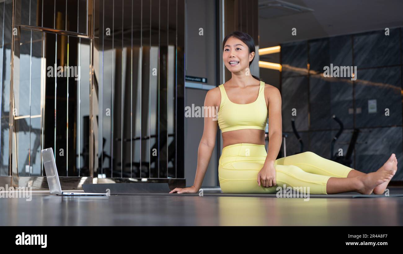 Social distance. A young woman stretching Yoga fitness instructor ...