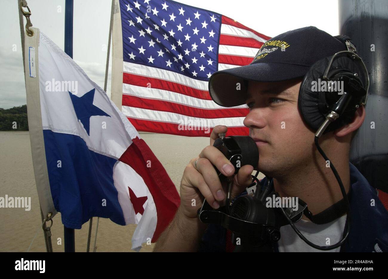 US Navy Electrician's Mate 1st Class stands watch on the sail bridge as ...