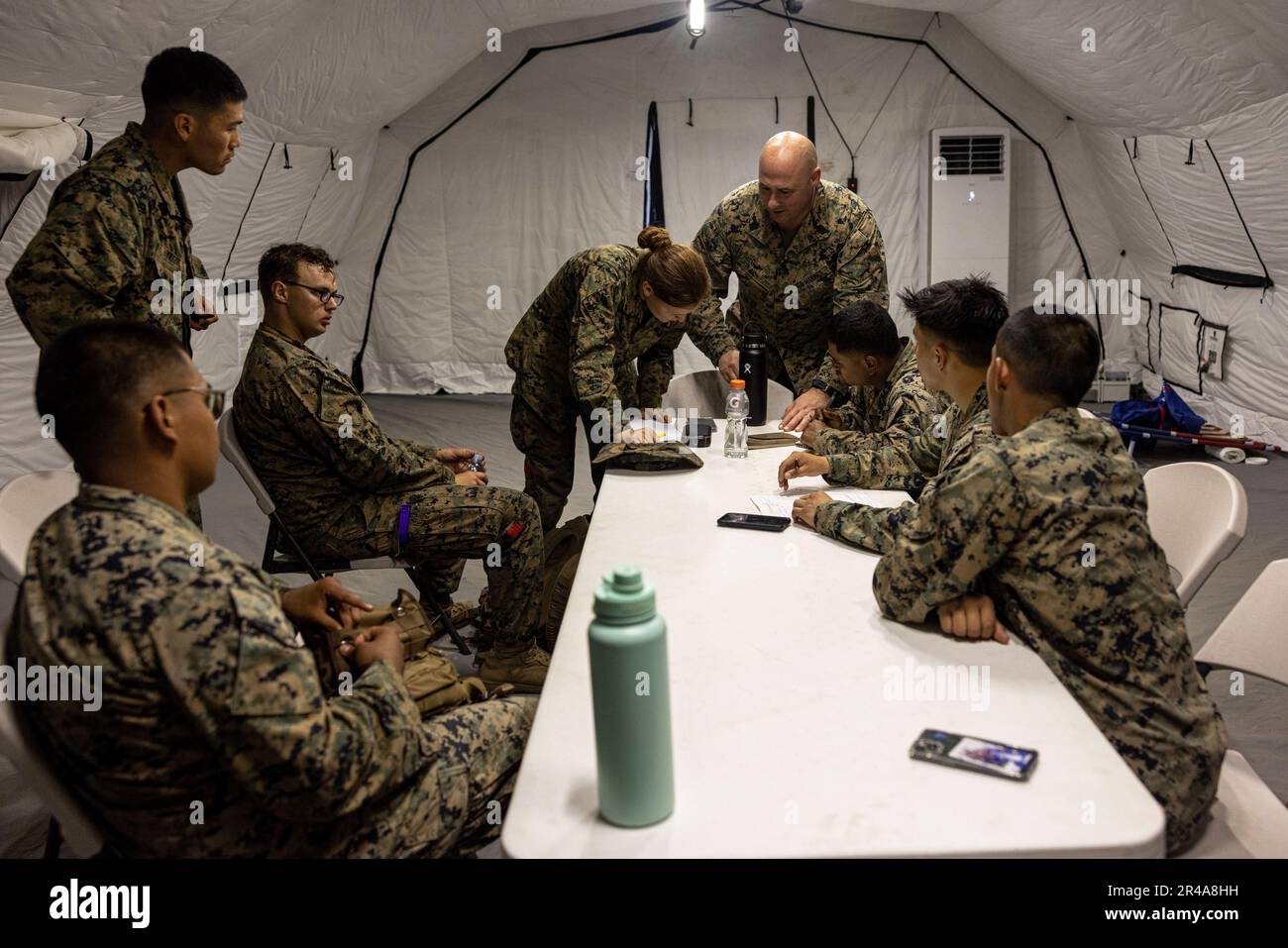 U.S. Marines with 3rd Landing Support Battalion, plan a convoy during a ...