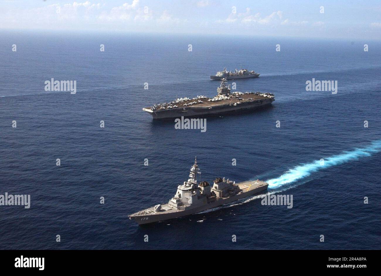 US Navy The Nimitz-class aircraft carrier USS John C. Stennis (CVN 74) steams in formation Stock ...