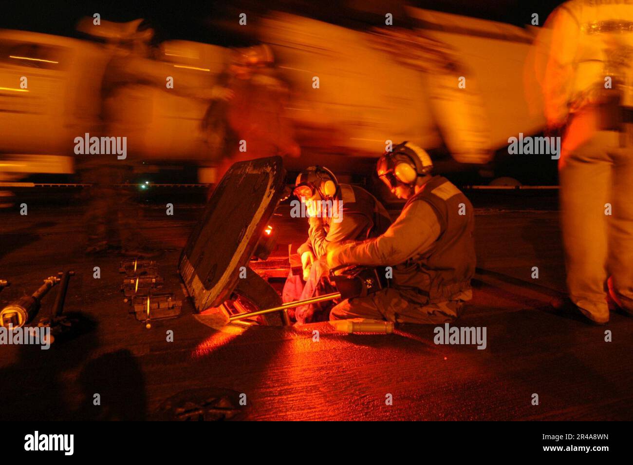 US Navy An E-2C Hawkeye is directed across the flight deck aboard the ...