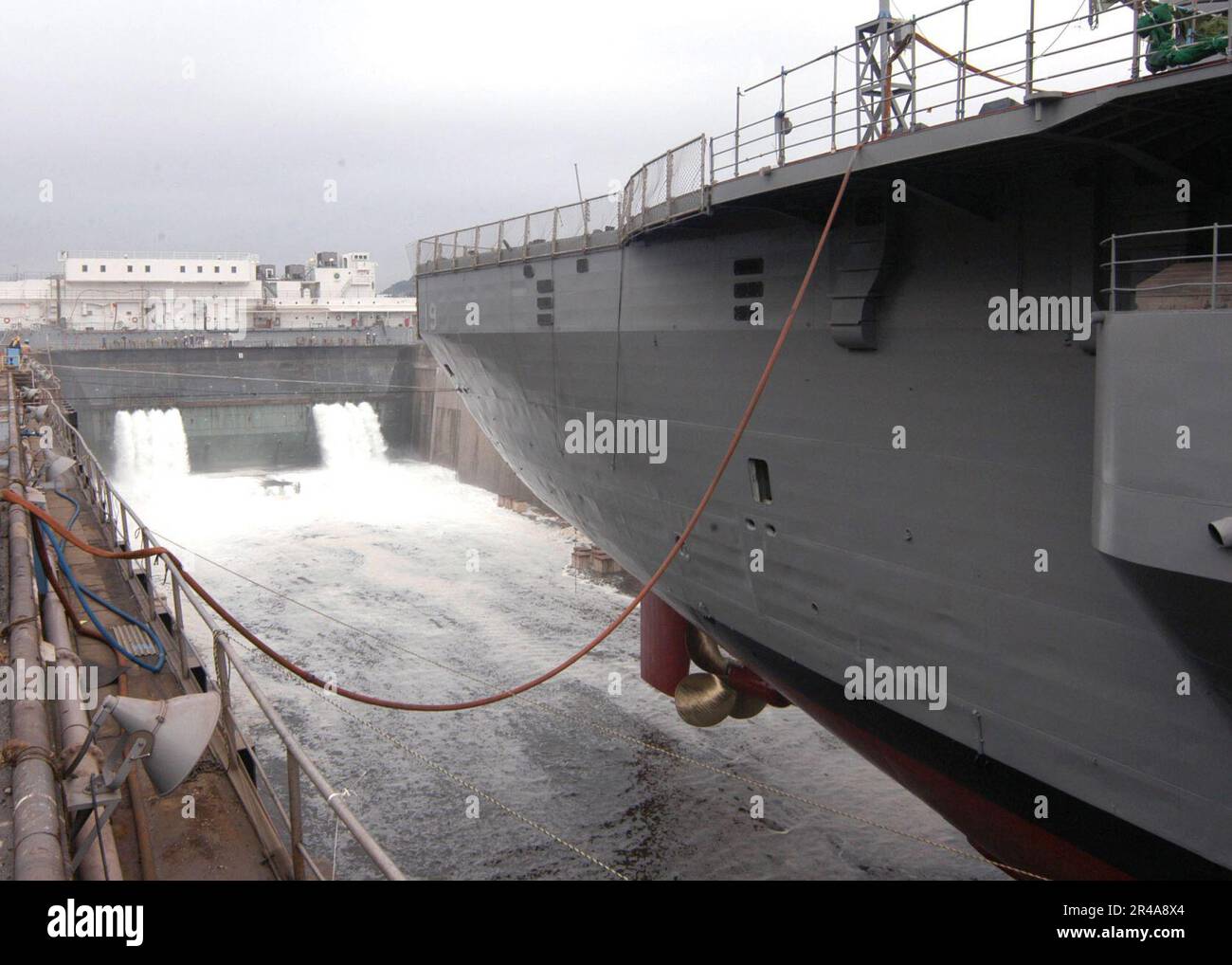 US Navy Water is allowed to fill the dry dock facility supporting the ...