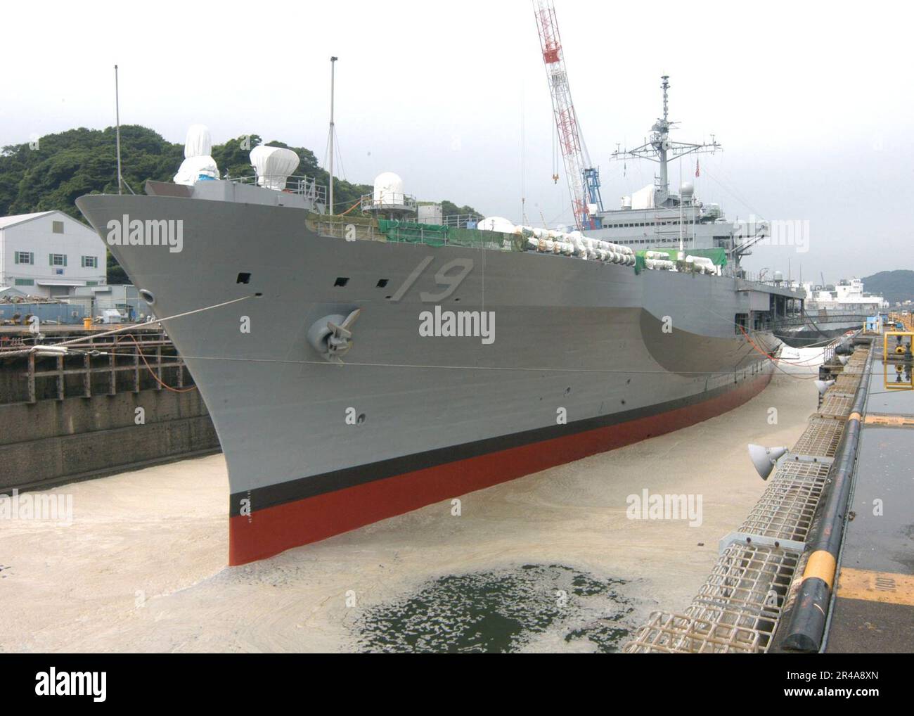 US Navy Water is allowed to fill the dry dock facility supporting the ...
