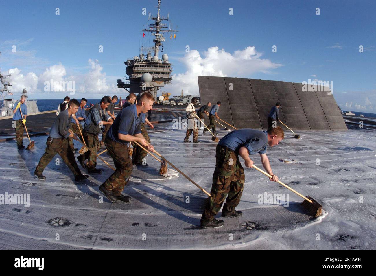 US Navy Sailors aboard the conventionally powered aircraft carrier USS ...