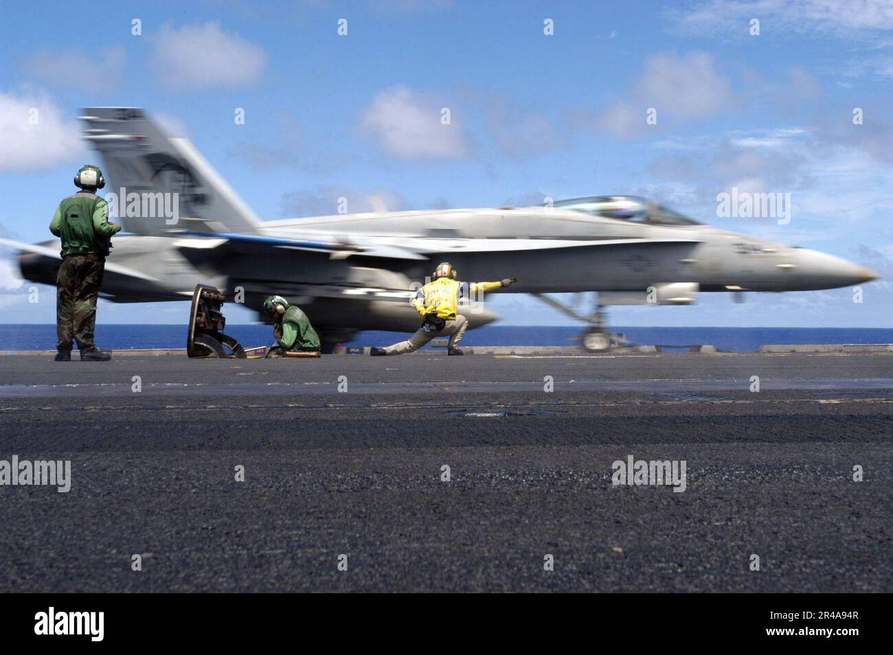 US Navy A catapult ''Shooter'' signals the launch of an F-A-18C Hornet ...