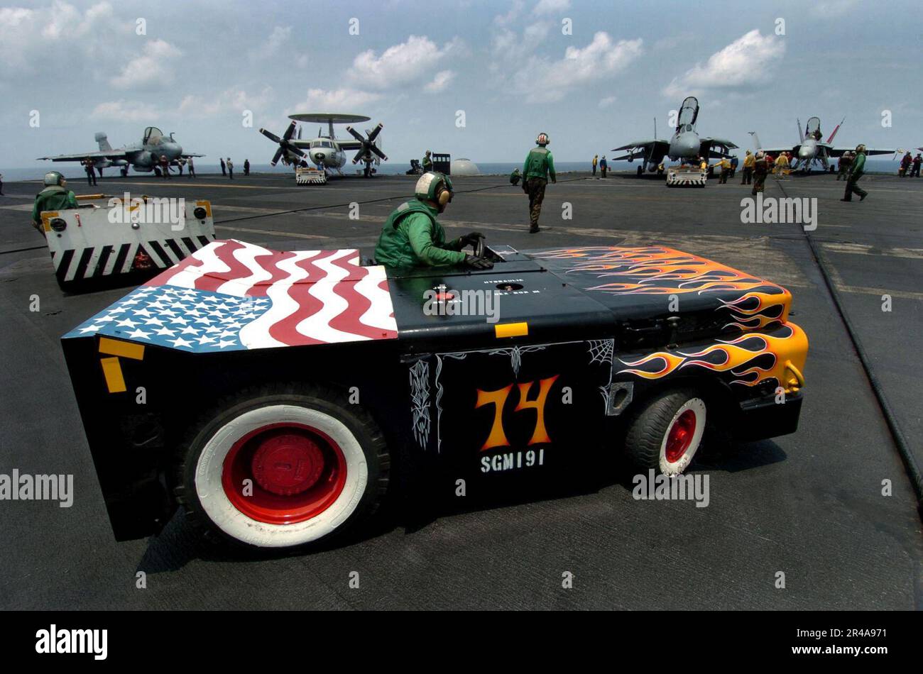 Us navy flight deck tractor hi-res stock photography and images - Alamy