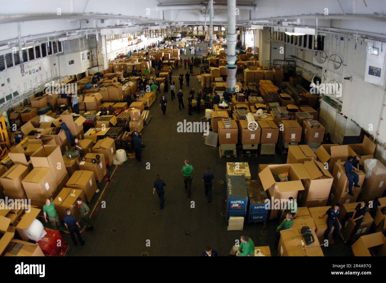 US Navy Squadron personnel assigned to Carrier Air Wing Five (CVW-5) stage equipment and ...