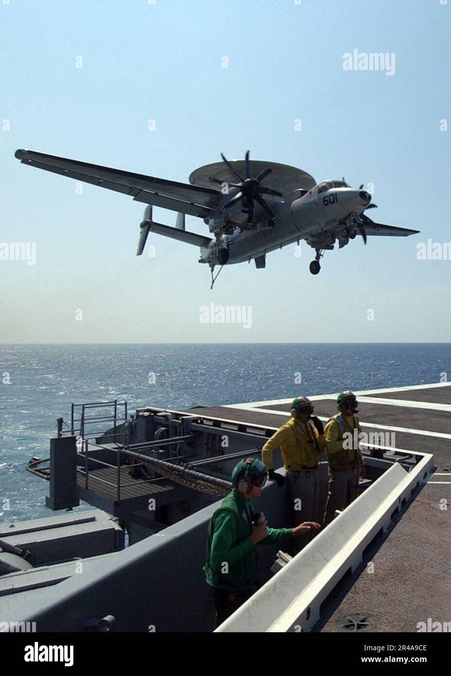 US Navy An E-2C- Hawkeye comes in for an arrested landing aboard the ...