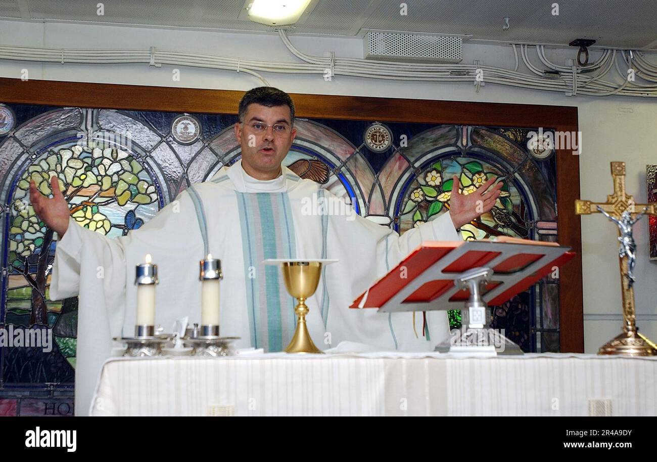 US Navy Cmdr. Michael Parisi of Paterson, N.J., conducts mid-day ...