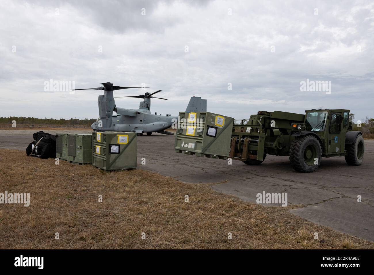 U.S. Marines with 2nd Marine Aircraft Wing (MAW) unload equipment from ...