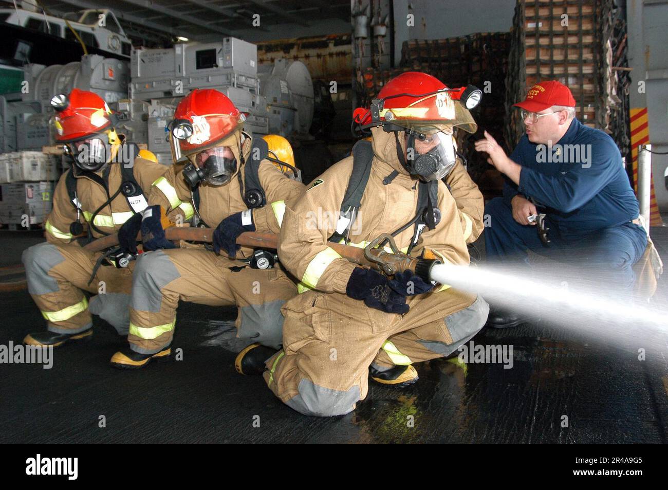 US Navy Hose team members assigned to a repair locker aboard the Nimitz ...