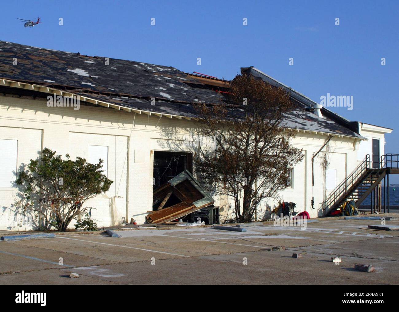 US Navy Hurricane Ivan removed the roof from Bldg. 27, the photo lab on ...