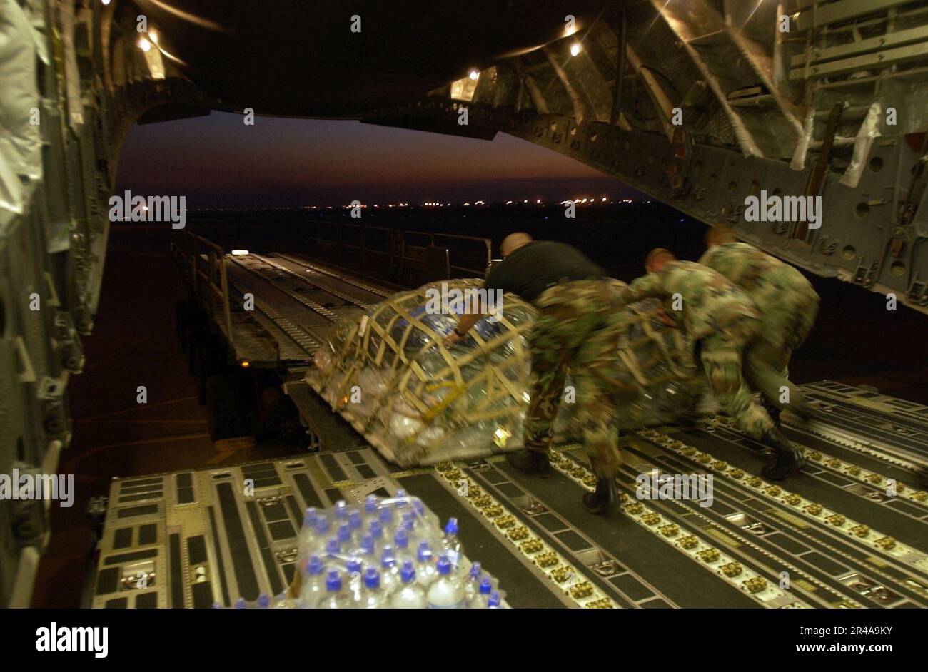 US Navy Joint Task Force Guantanamo personnel load a pallet onto a ...