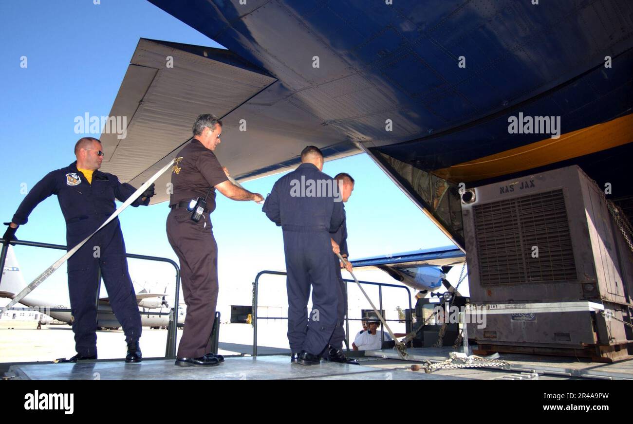 US Navy Blue Angel's support crew offload generators from Fat Albert, a ...