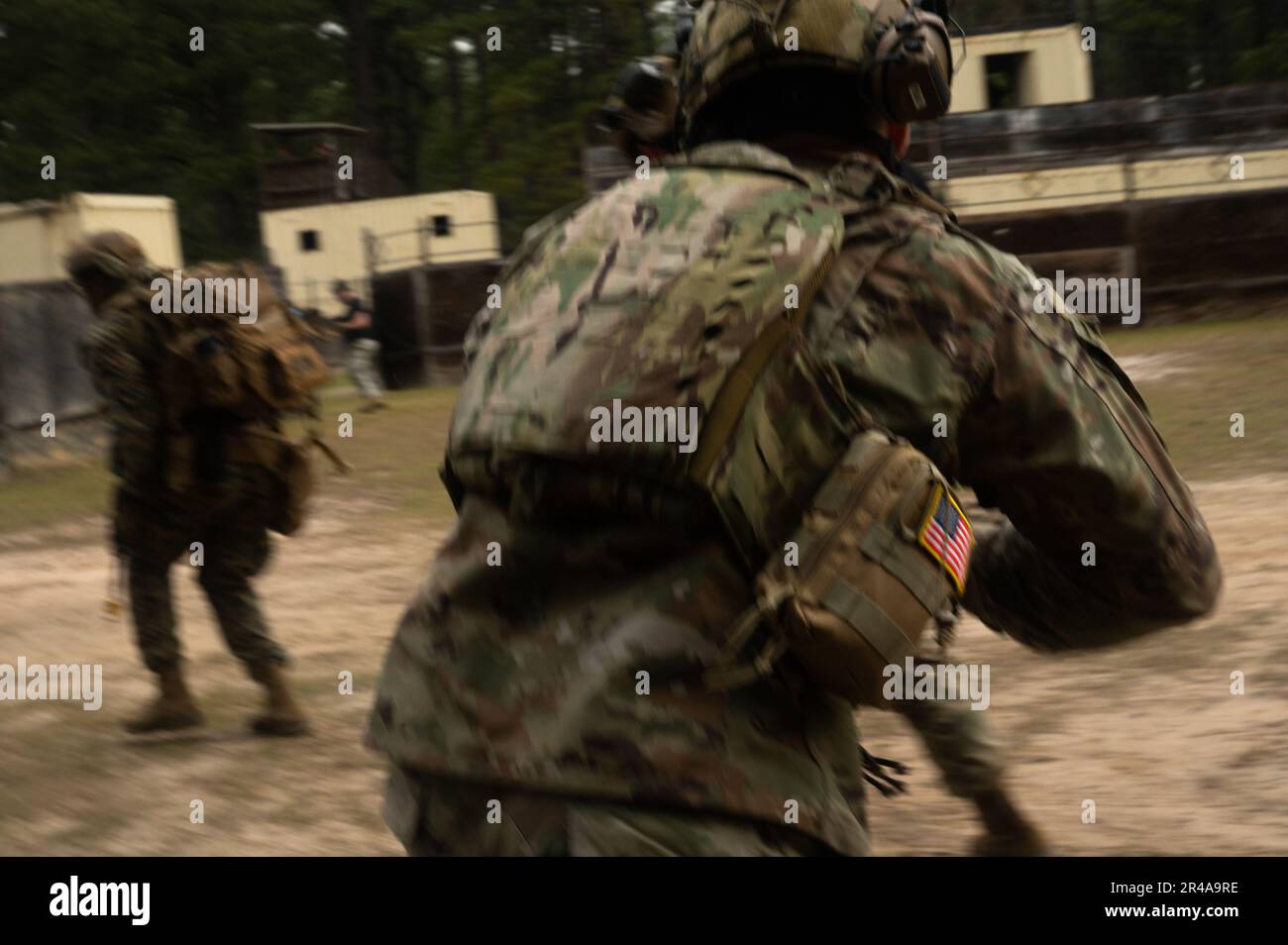 Combat Cameramen react to shots fired by simulated opposing forces in a ...