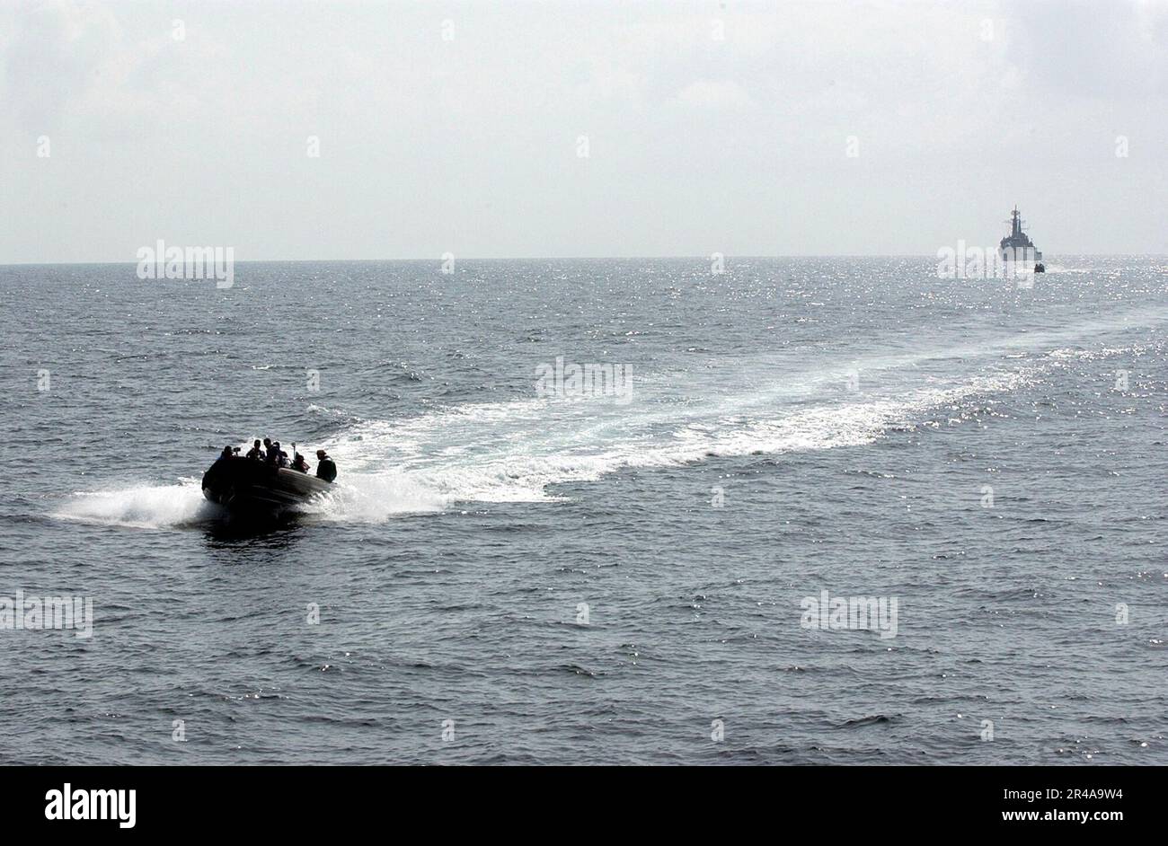 US Navy A Rigid Hull Inflatable Boat (RHIB) carries American and ...