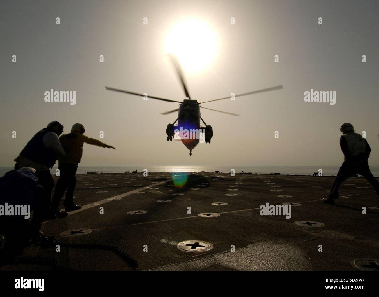 US Navy Sailors assigned to the Deck Department aboard the dock landing ...