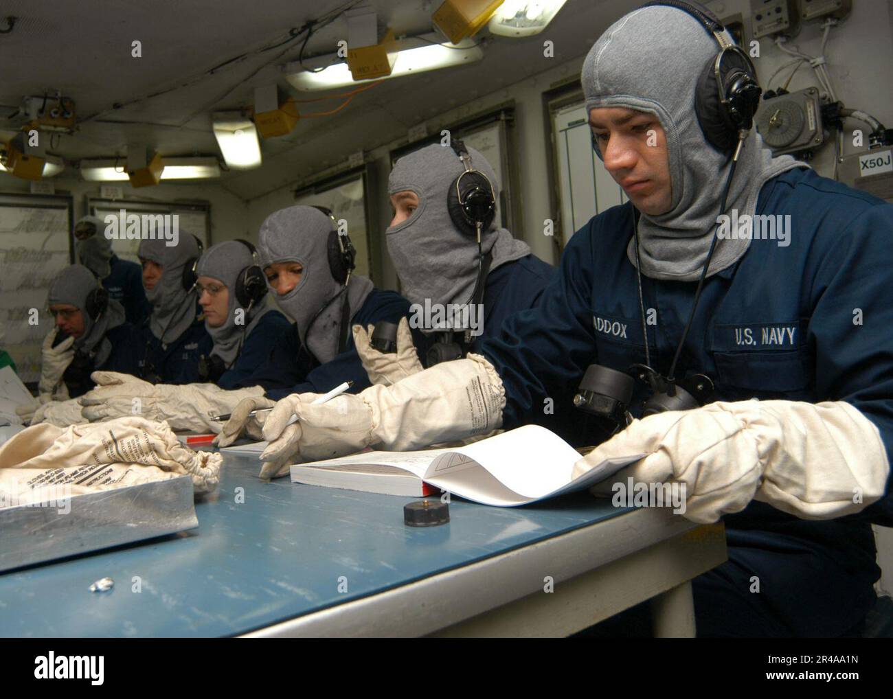 US Navy Sound powered phone talkers receive messages in Damage Control ...