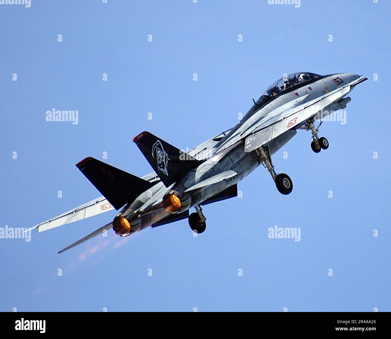 US Navy An F-14D Tomcat takes off in full afterburner after ...