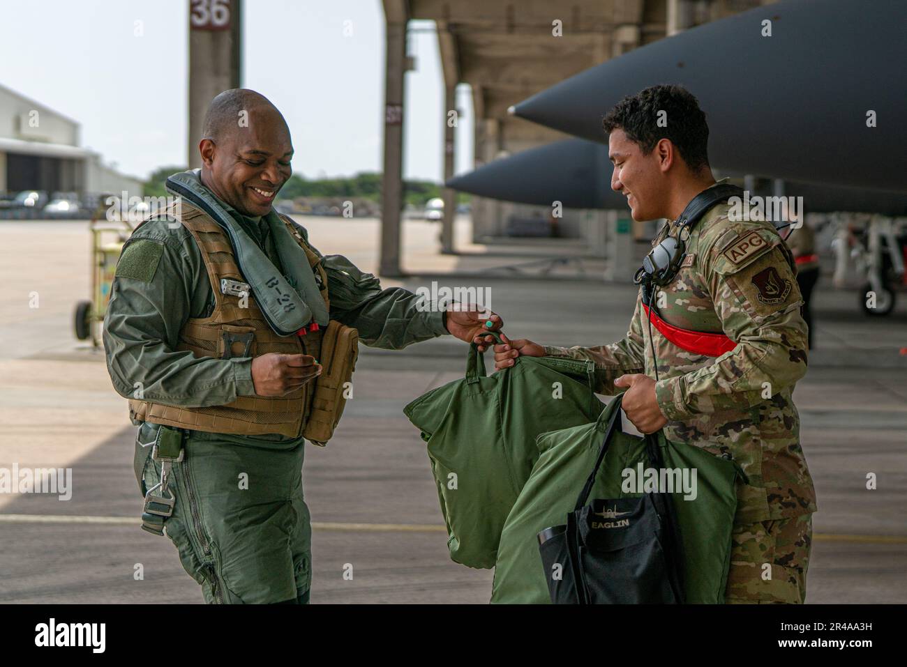 U.S. Air Force Chief Master Sgt. Ronnie Woods, left, 18th Wing command ...