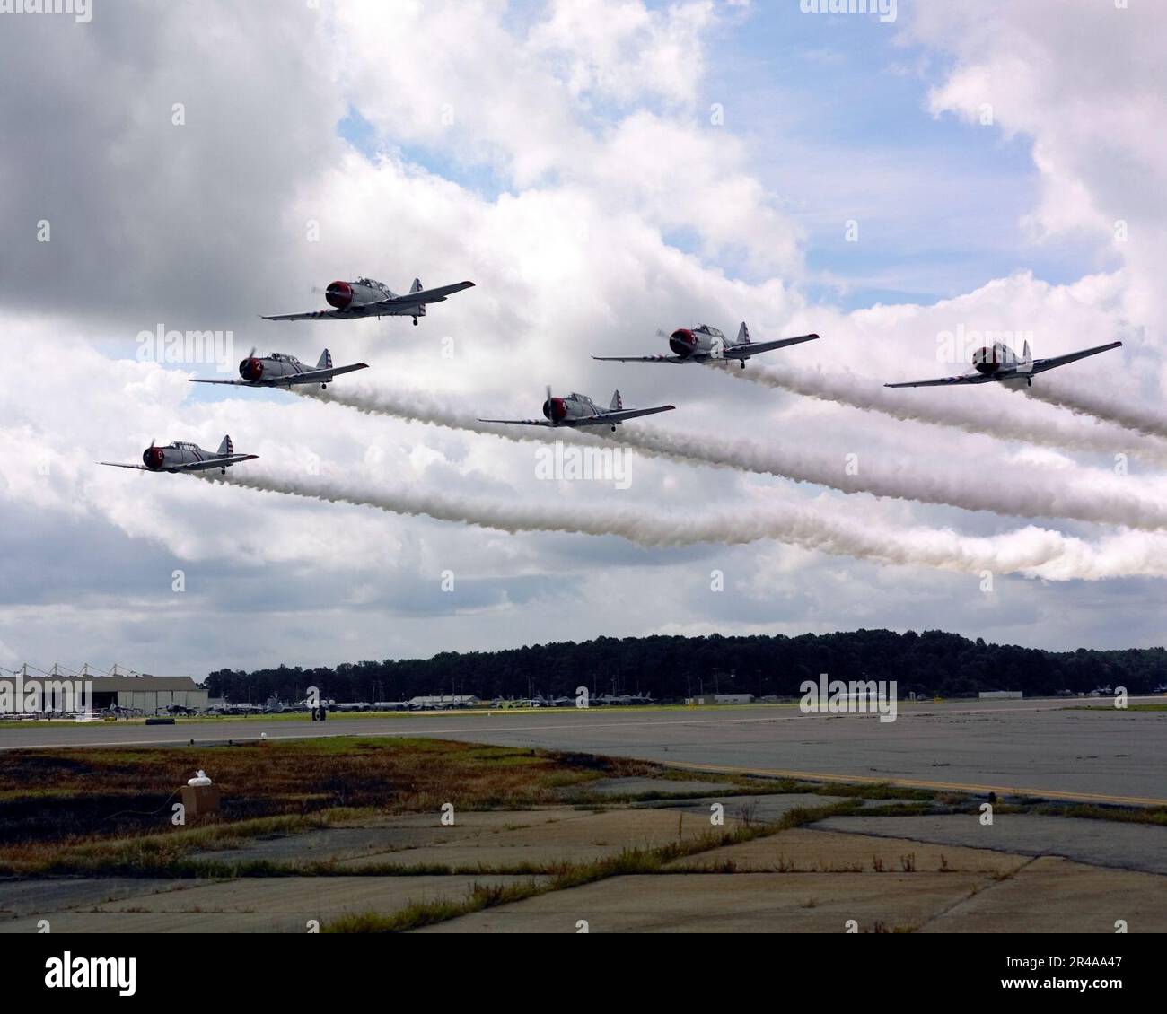 US Navy The Skytypers Air Show Team fly down the runway in formation at ...