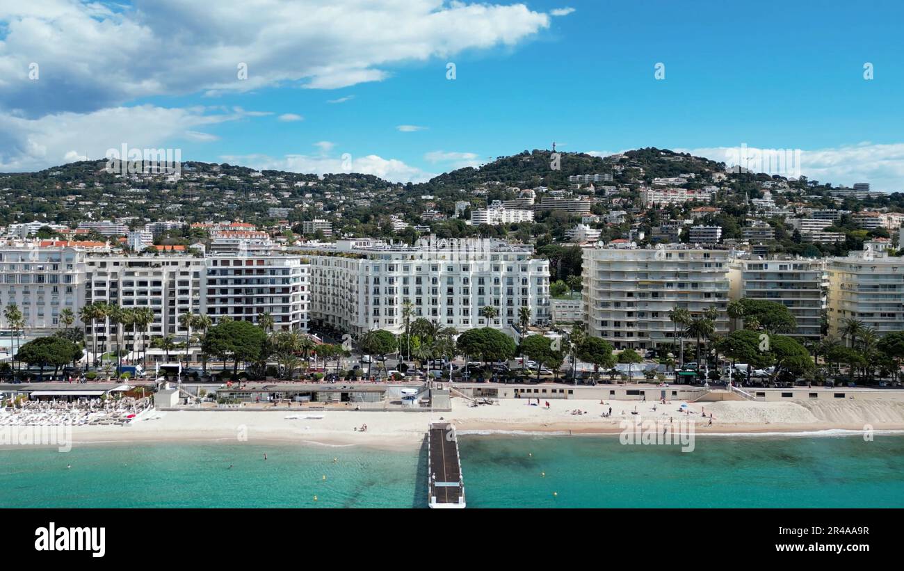 An aerial view of a coastal town with multiple buildings on the French ...
