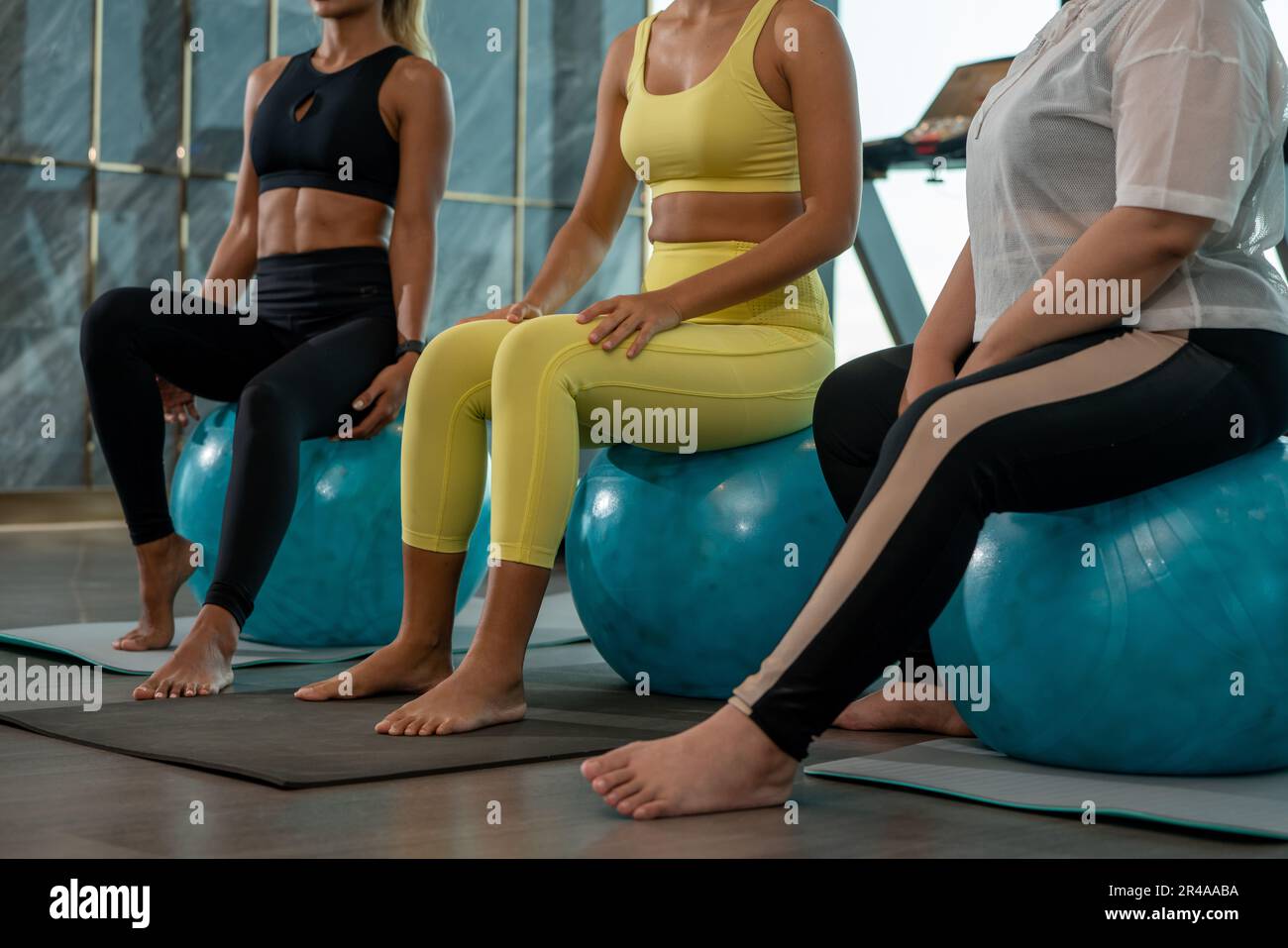 Humor in sports Ball Yoga. Fat Asian woman with her Yoga Instrutor ...